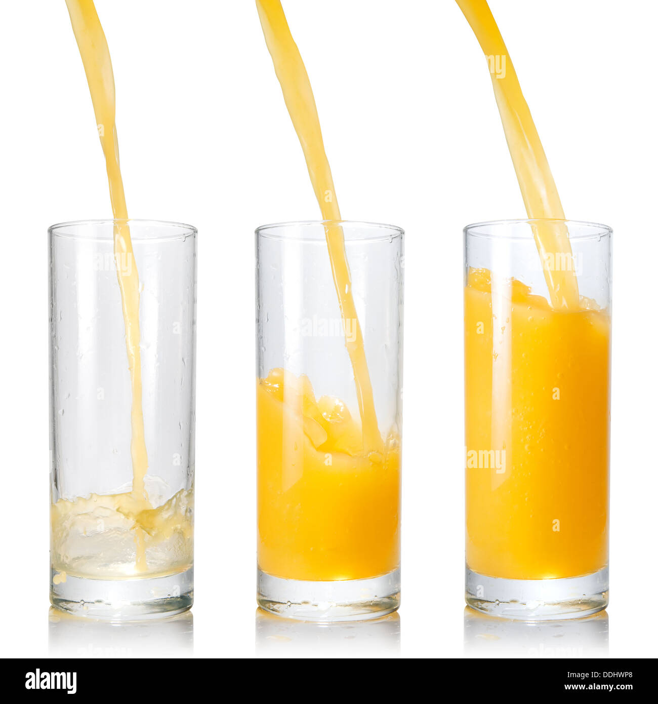 Pouring orange juice into the glass isolated on white Stock Photo - Alamy
