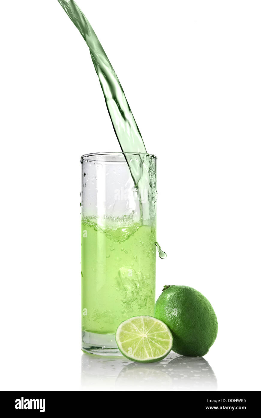 green juice with lime pouring into glass isolated on white Stock Photo ...