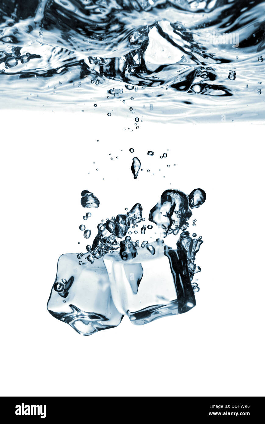 ice cubes dropped into water with splash isolated on white Stock Photo - Alamy