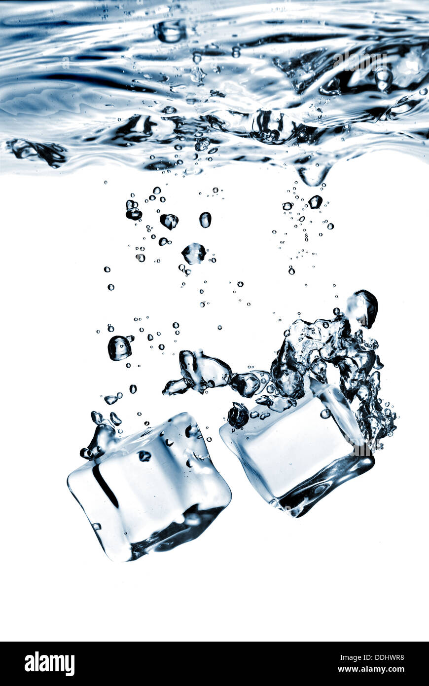 ice cubes dropped into water with splash isolated on white Stock Photo - Alamy