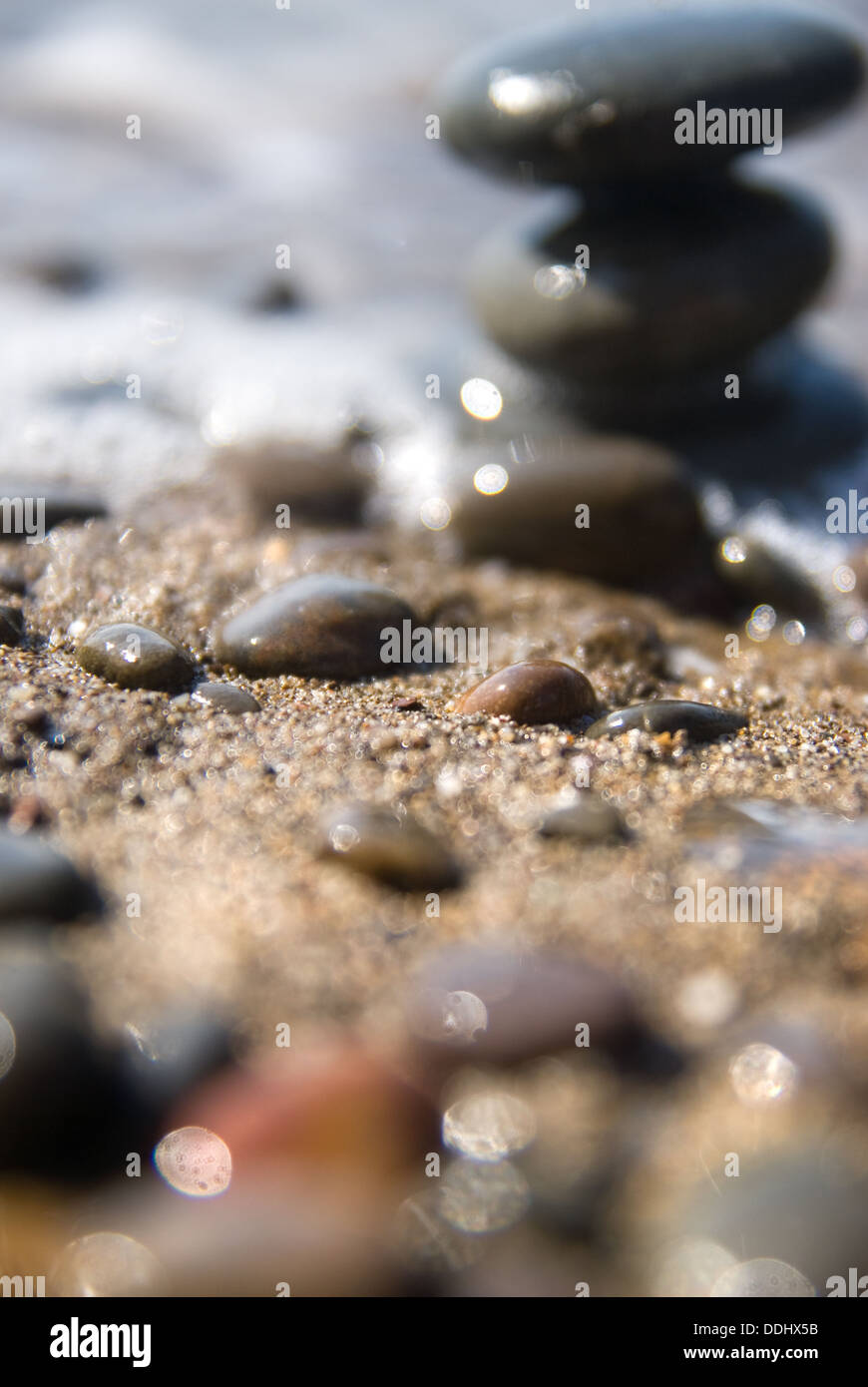 stones and water wave Stock Photo - Alamy