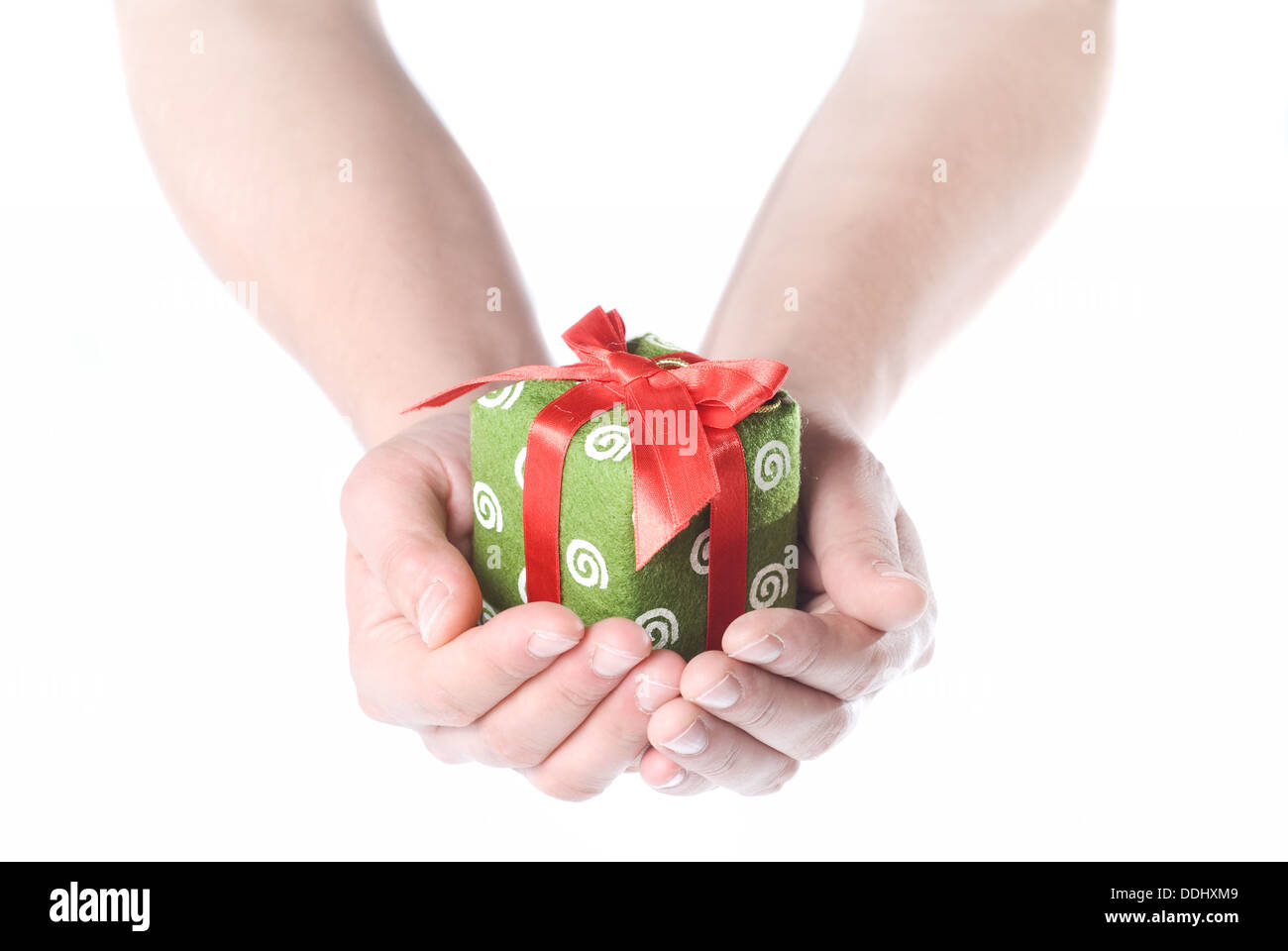 Hands holding gift isolated on white Stock Photo - Alamy
