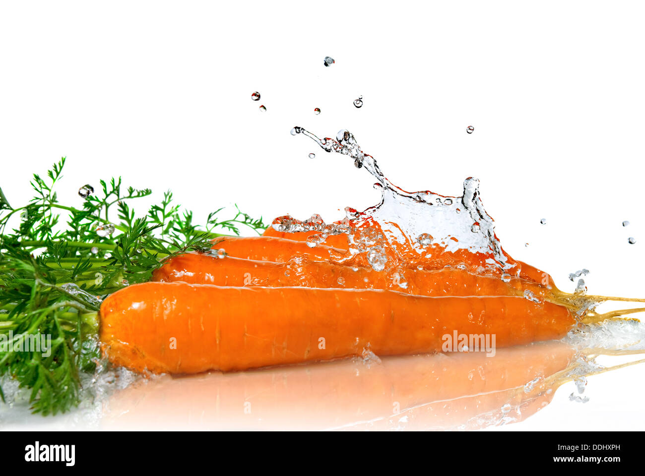 fresh water splash on carrot isolated on white Stock Photo - Alamy