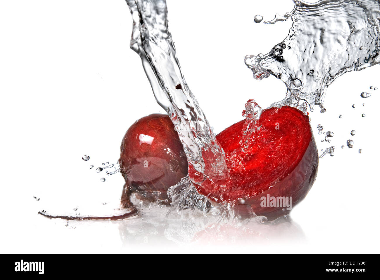 red beet with water splash isolated on white Stock Photo - Alamy