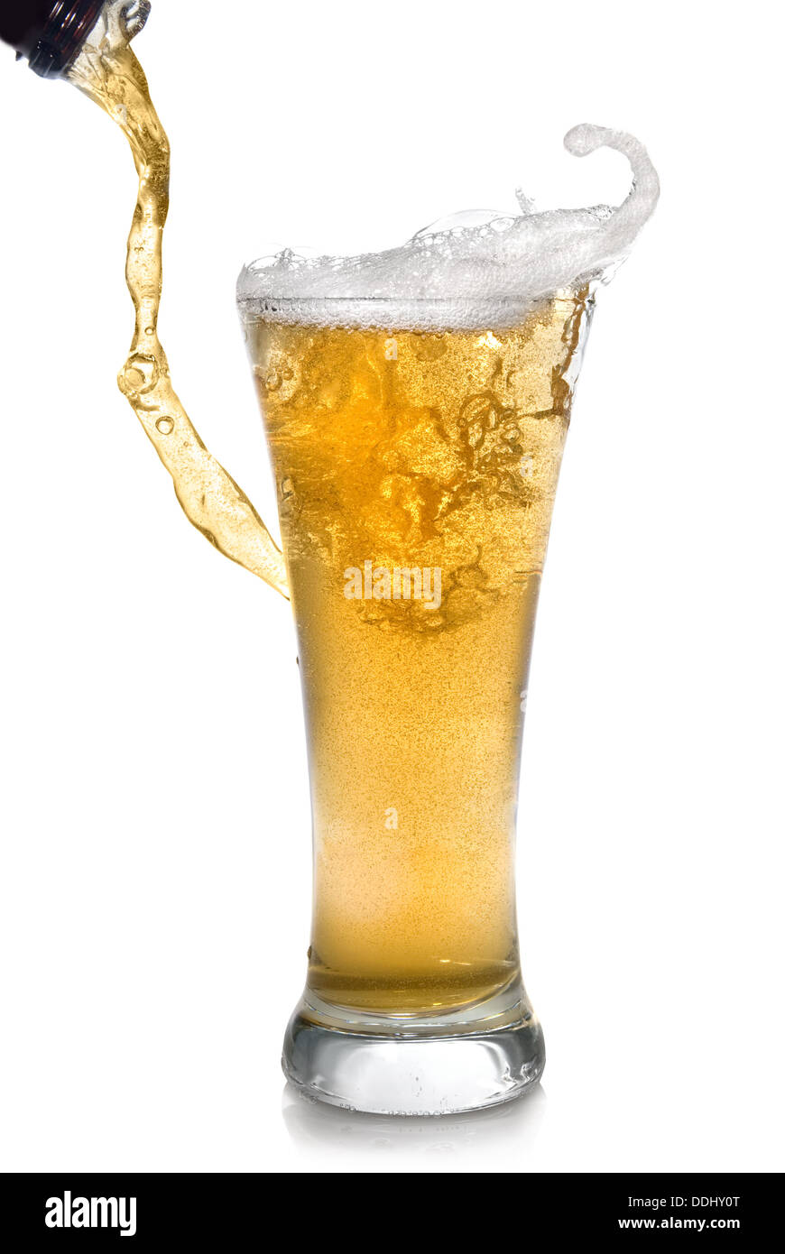 Beer pouring from bottle into glass isolated on white Stock Photo - Alamy