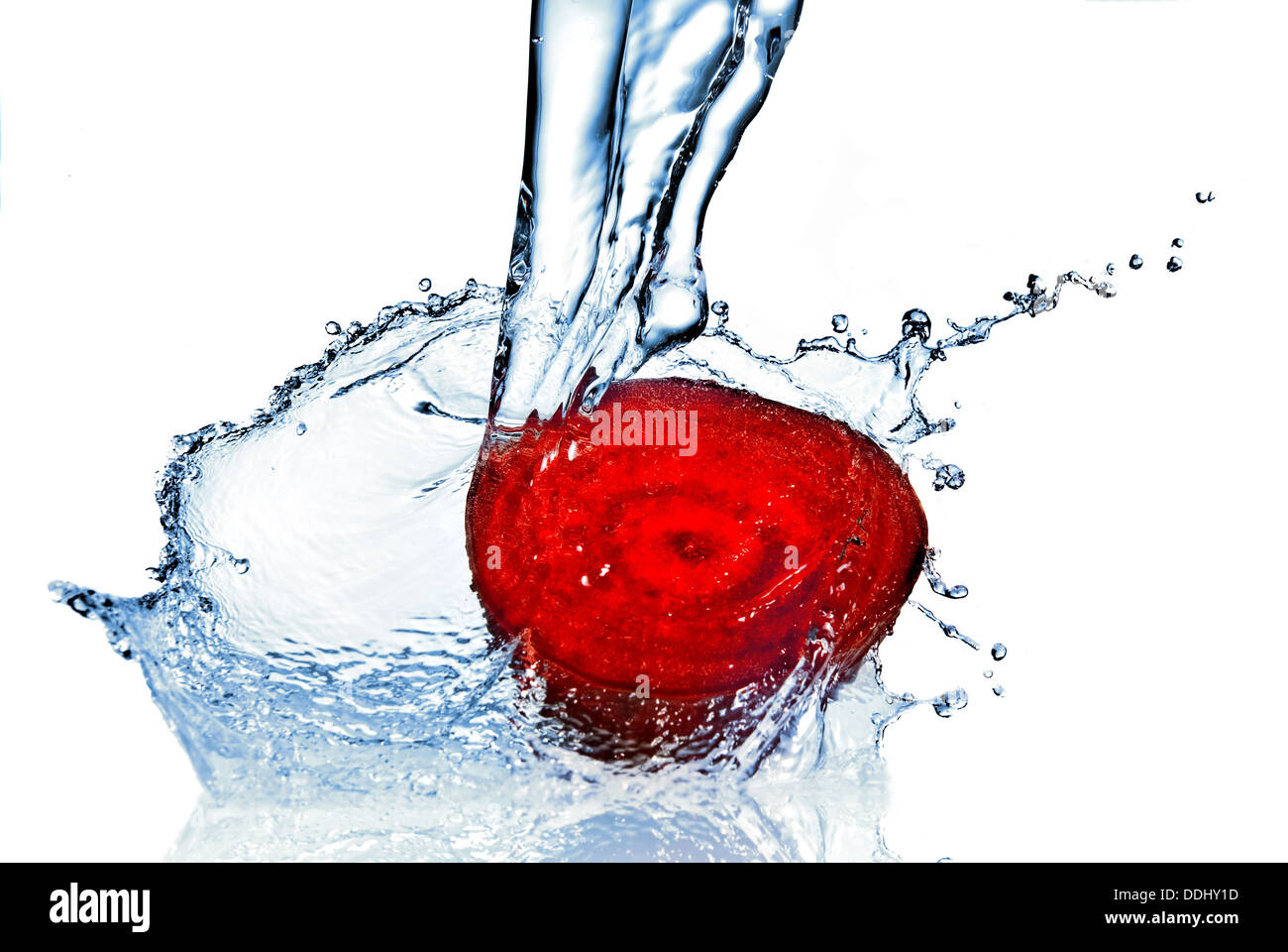 red beet with water splash isolated on white Stock Photo - Alamy