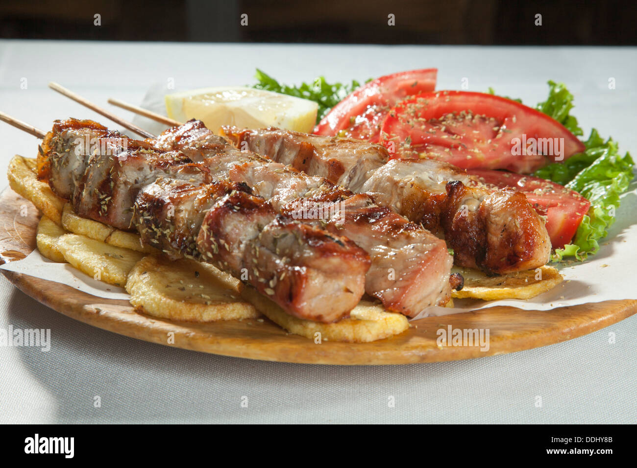 Beef chicken pork meat cooked grilled served with rice potatoes red and ...