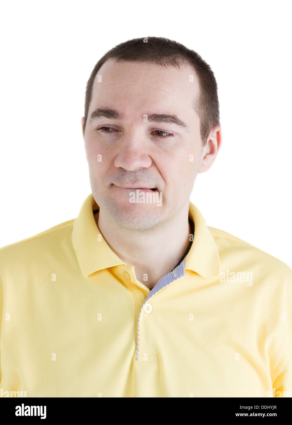 man bit his lip and looks away on white background Stock Photo - Alamy