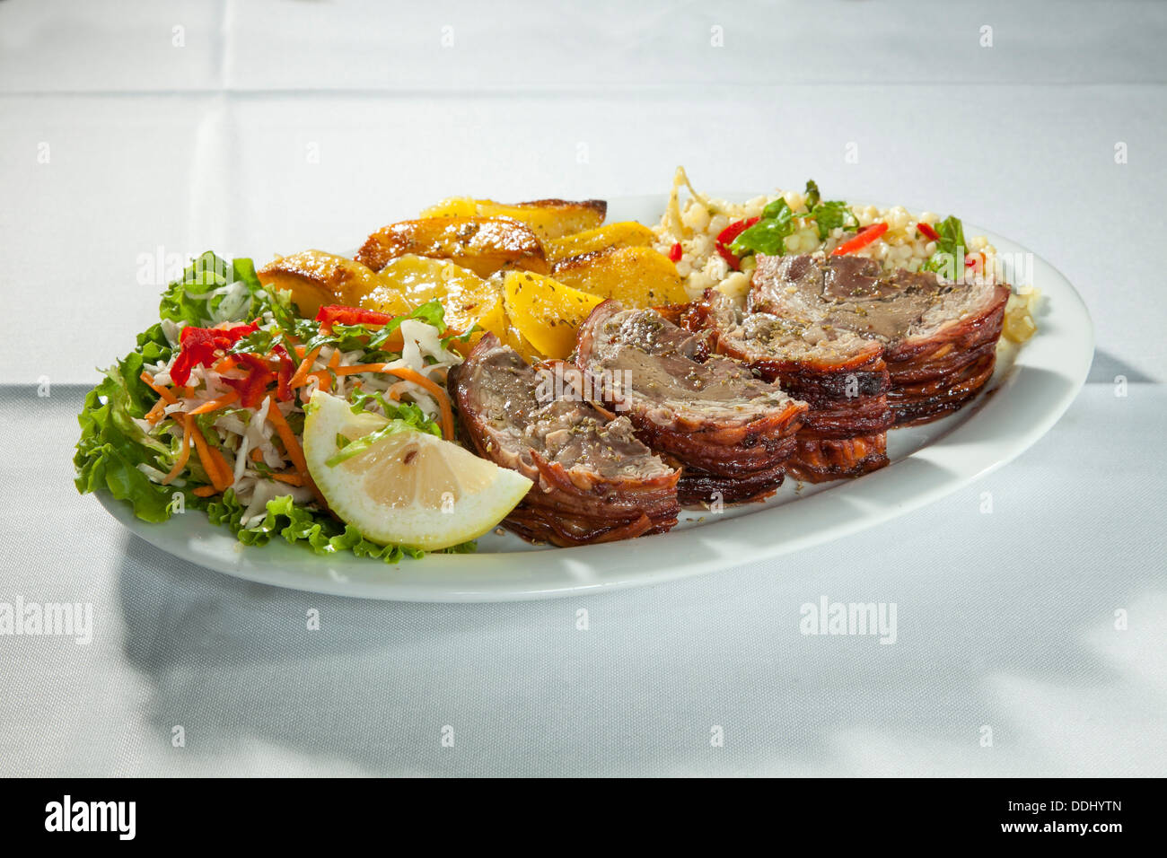Beef chicken pork meat cooked grilled served with rice potatoes red and ...
