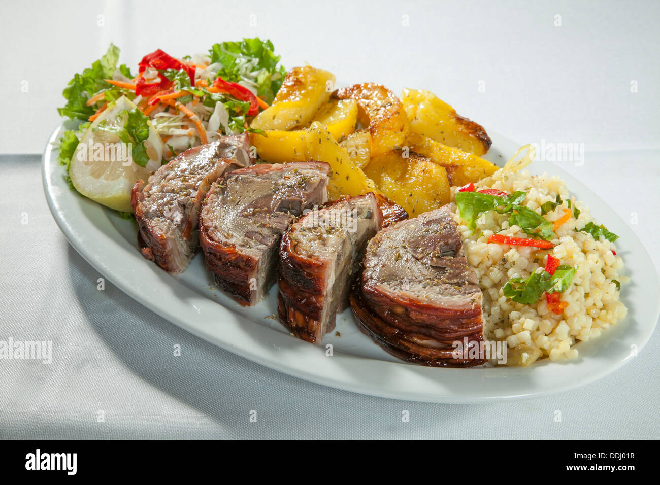 Beef chicken pork meat cooked grilled served with rice potatoes red and ...
