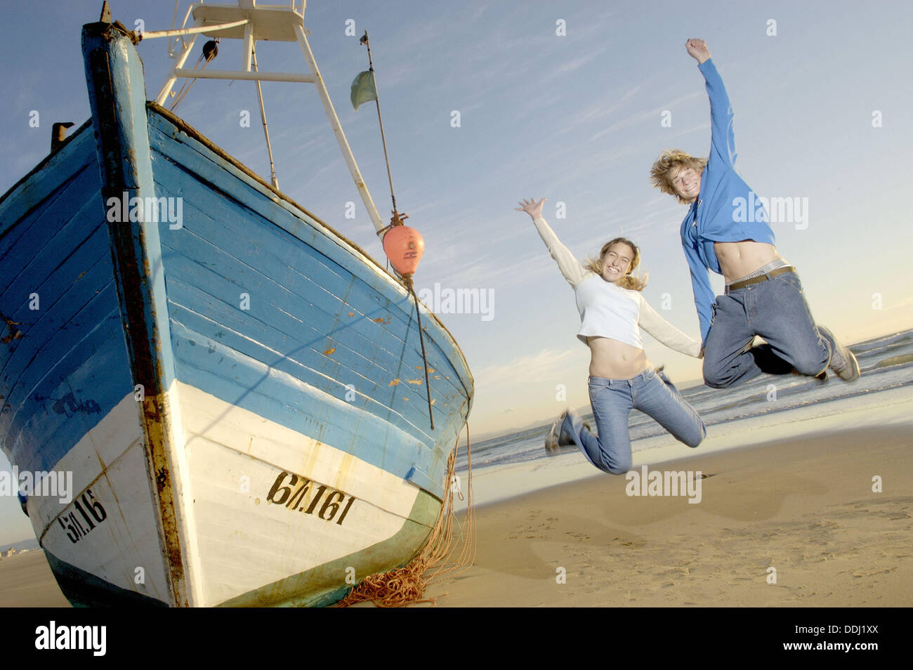 Couple jumping boat hi-res stock photography and images - Alamy