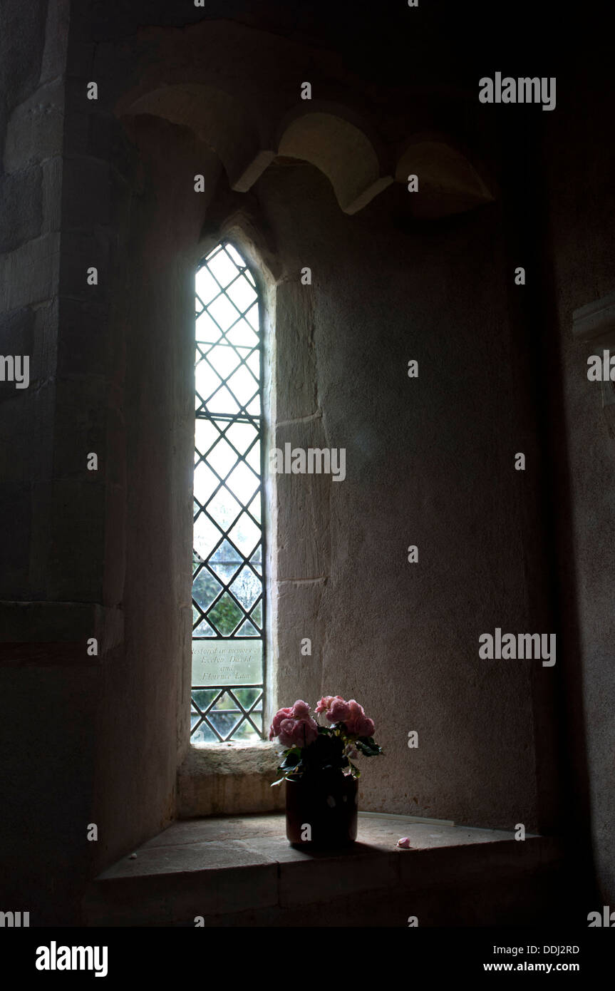 A small window in St. Peter`s Church, Little Rissington ...
