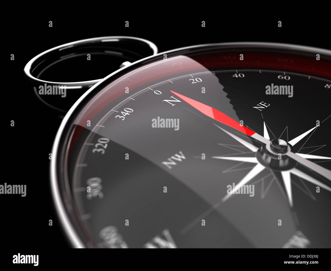 Close up of a compass with needle pointing the north, image over black ...
