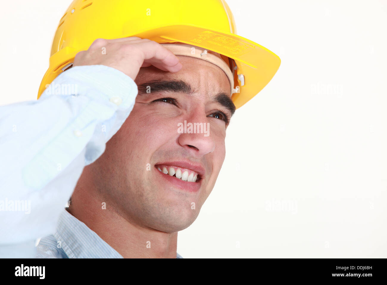 Builder suffering from head ache Stock Photo - Alamy