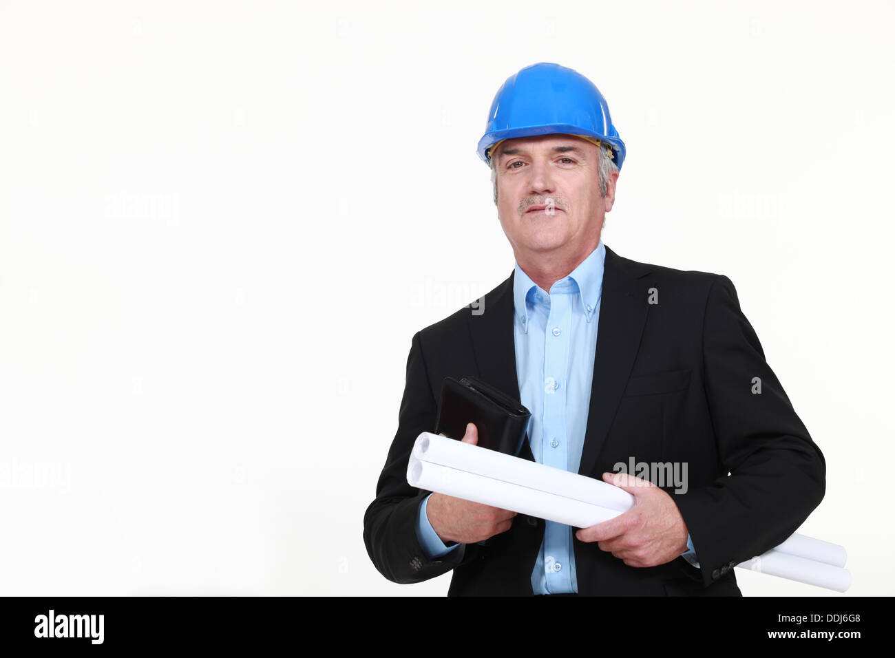 Engineer holding a rolled-up blueprint and an agenda Stock Photo - Alamy