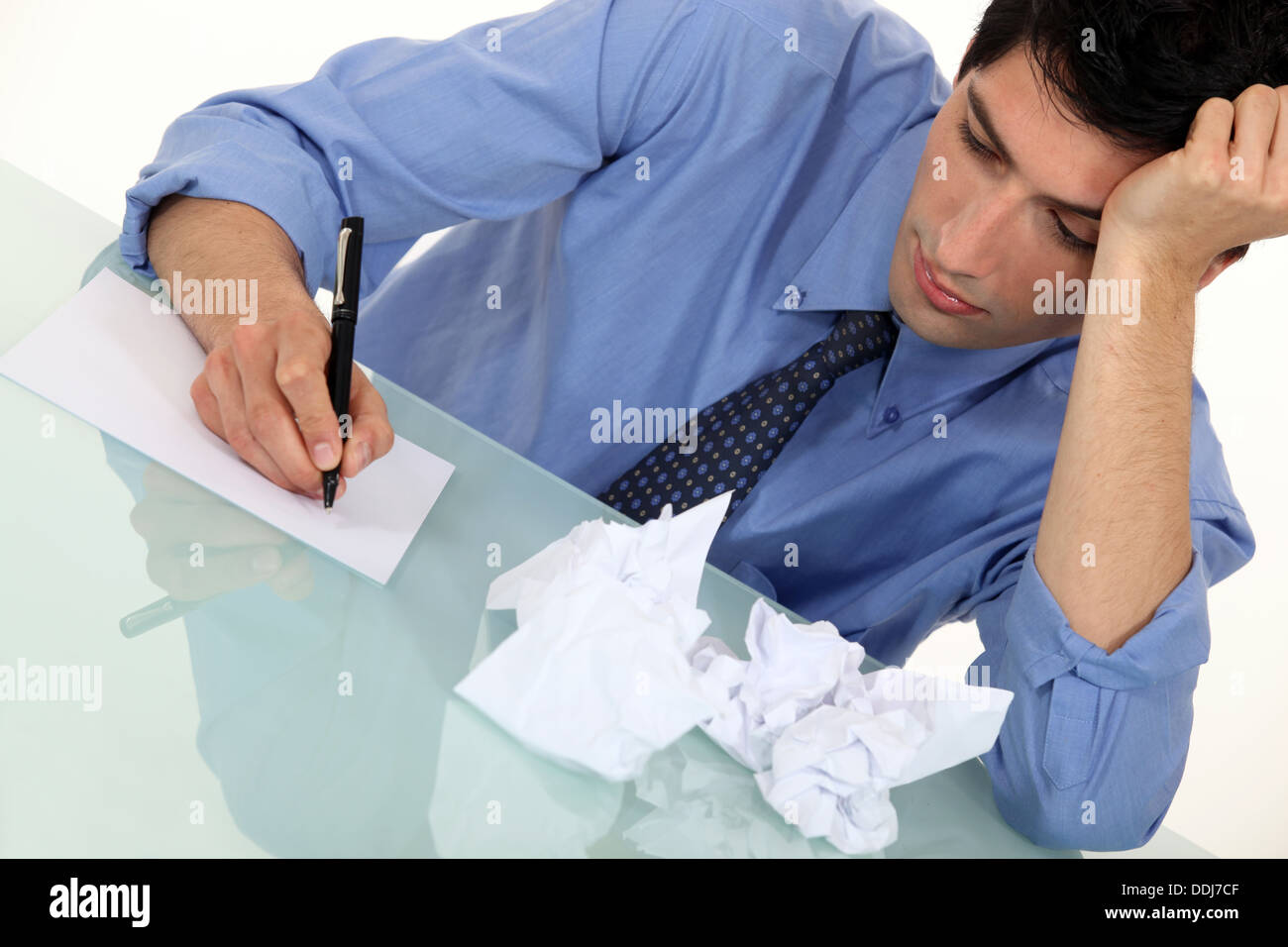 A businessman writing Stock Photo - Alamy