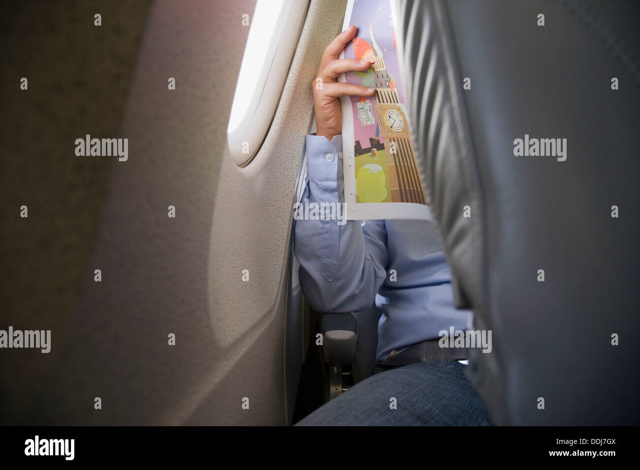 Read newspaper airplane hi-res stock photography and images - Alamy
