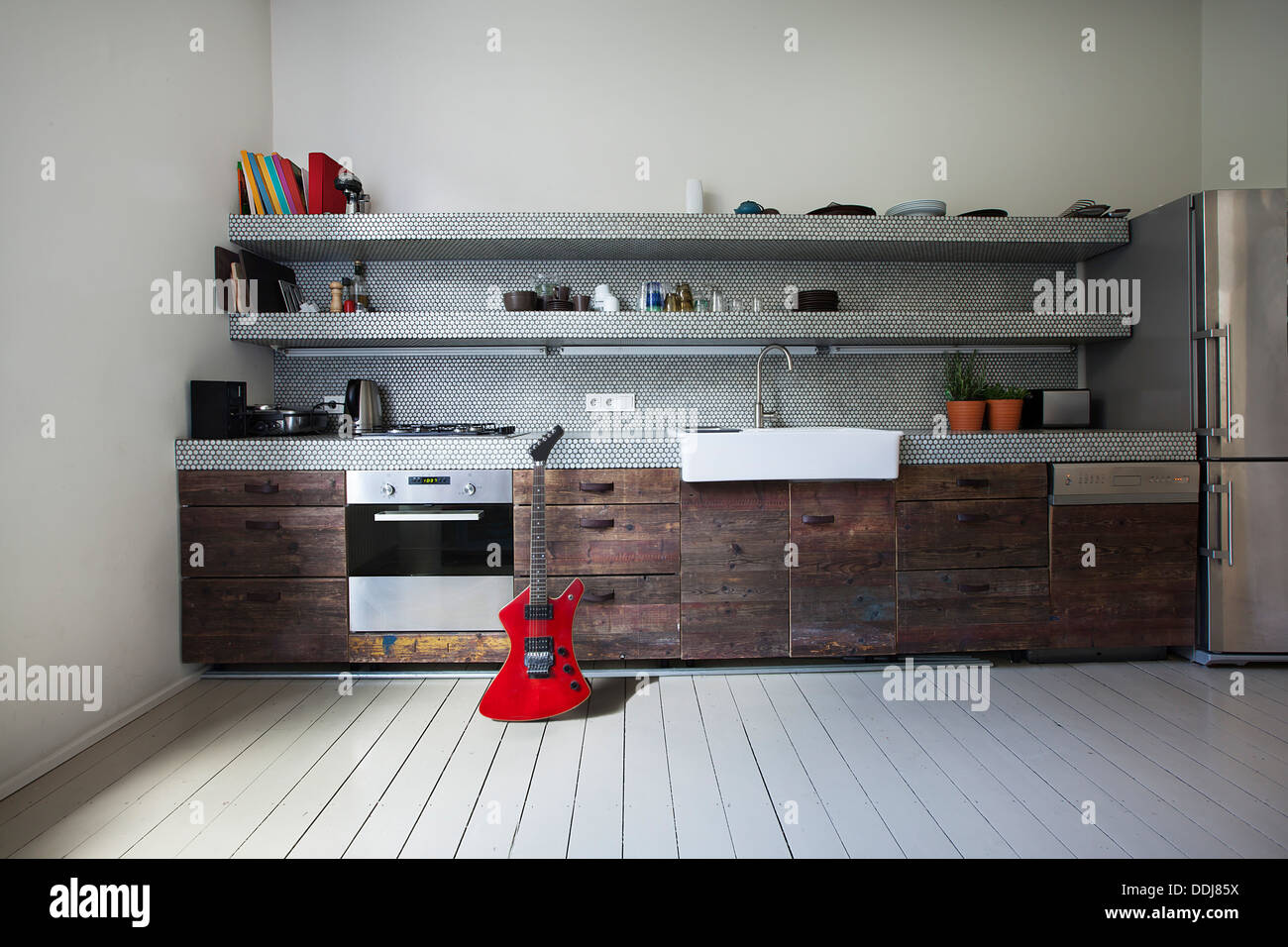 Interior of kitchen with electric guitar Stock Photo - Alamy