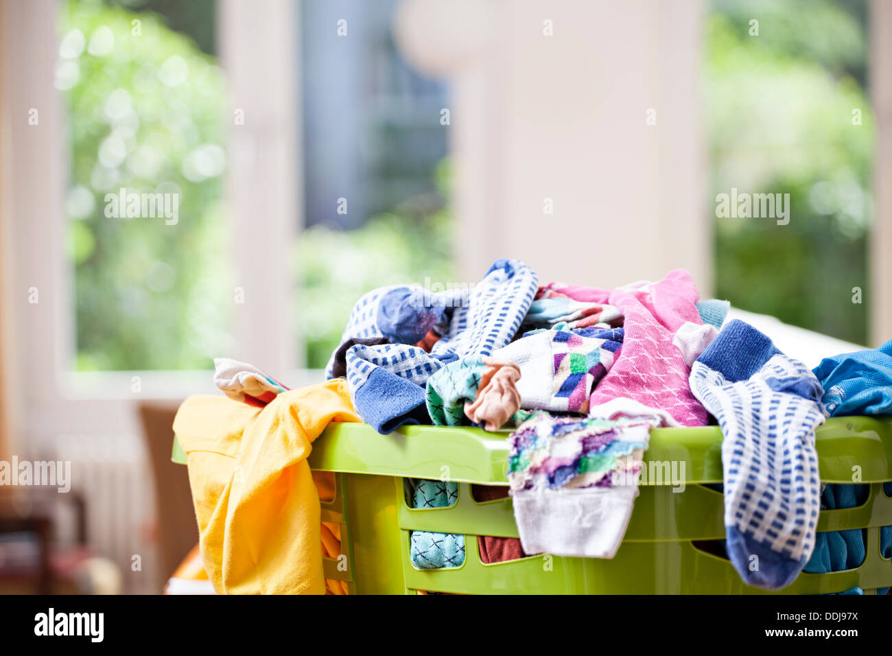 Germany, North Rhine Westphalia, Cologne, Clothes in laundry basket ...