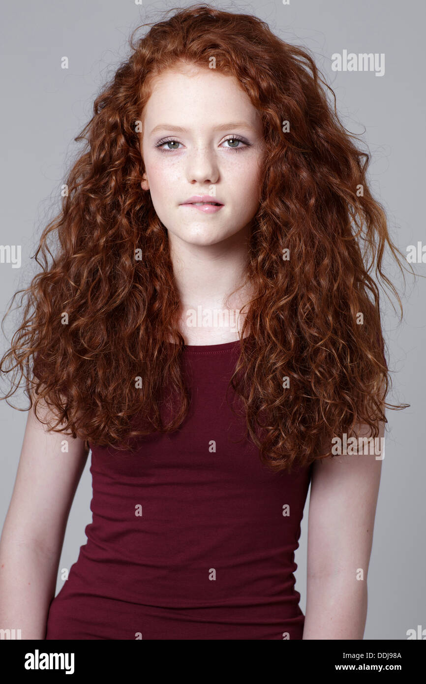 Portrait of girl biting lip, close up Stock Photo - Alamy