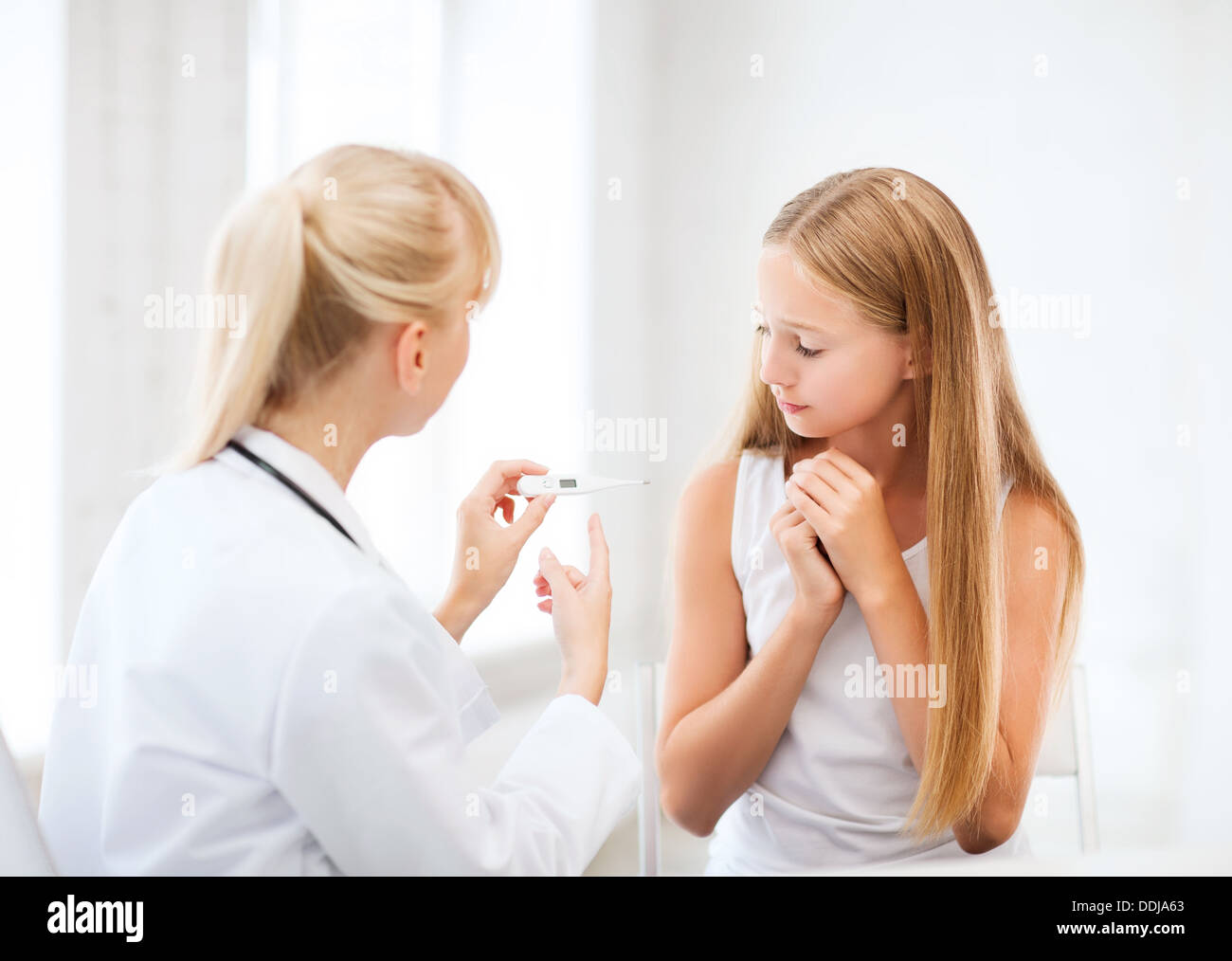 doctor with child measuring temperature Stock Photo - Alamy