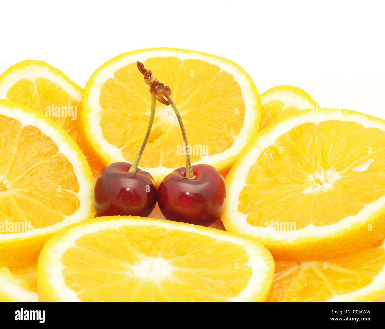 Cherry and oranges on a white background Stock Photo - Alamy
