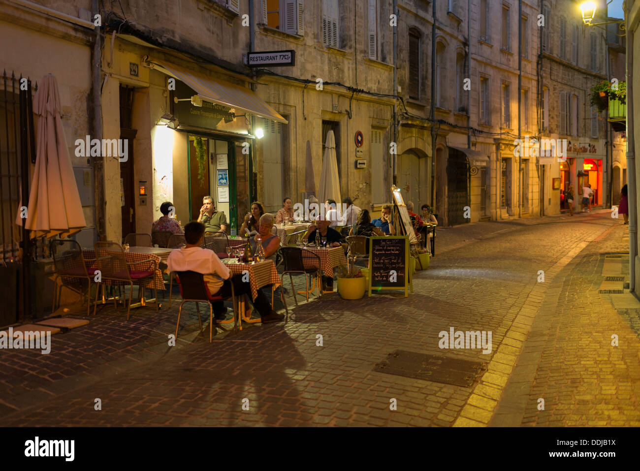 Restaurant in the narrow streets of Avignon, France Stock Photo - Alamy