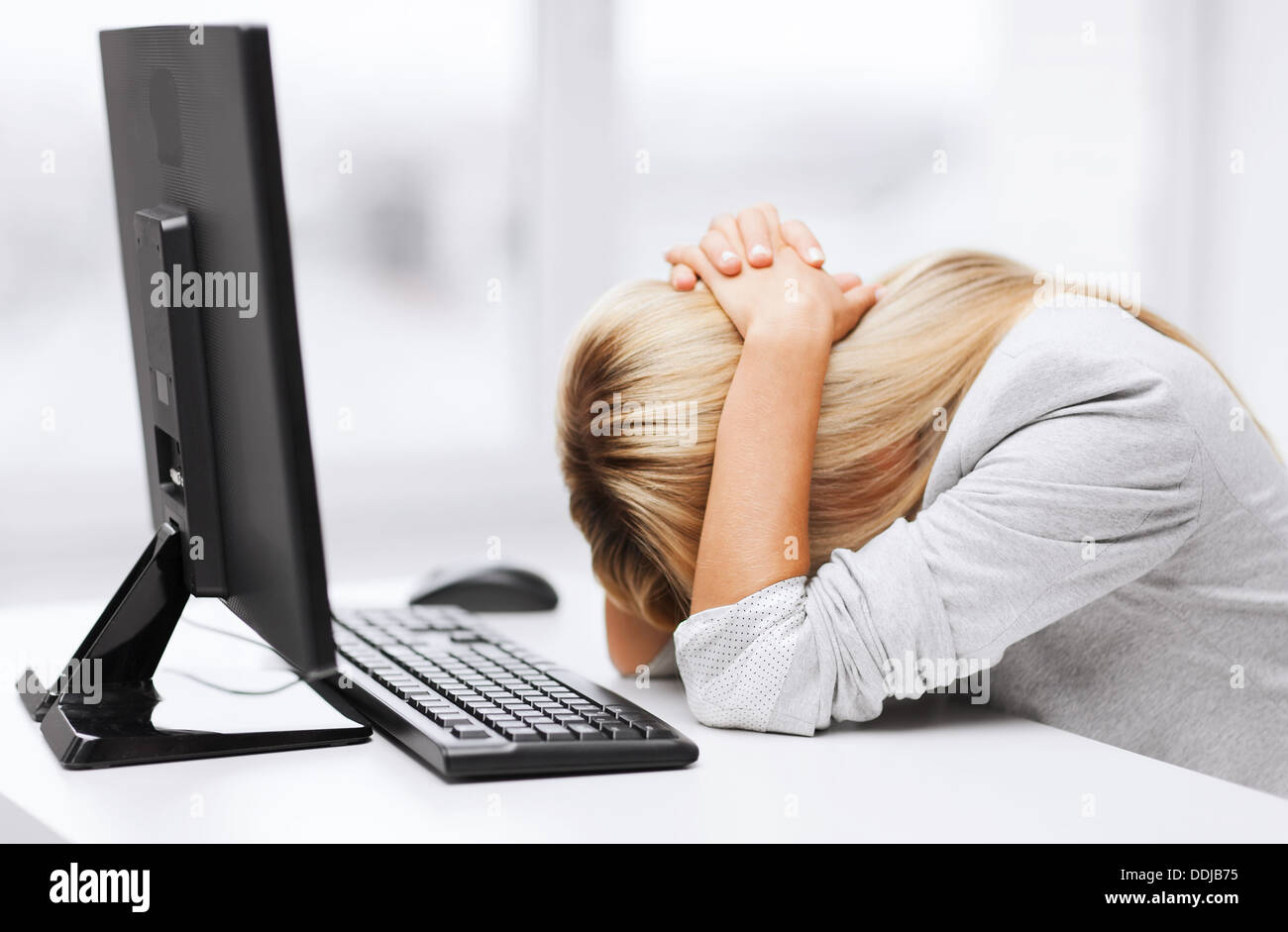 stressed woman with computer Stock Photo - Alamy