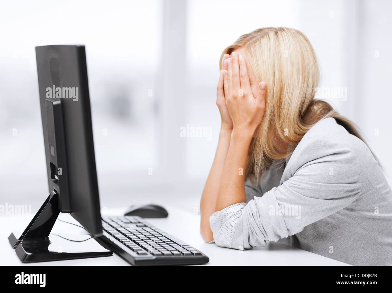 stressed woman with computer Stock Photo - Alamy