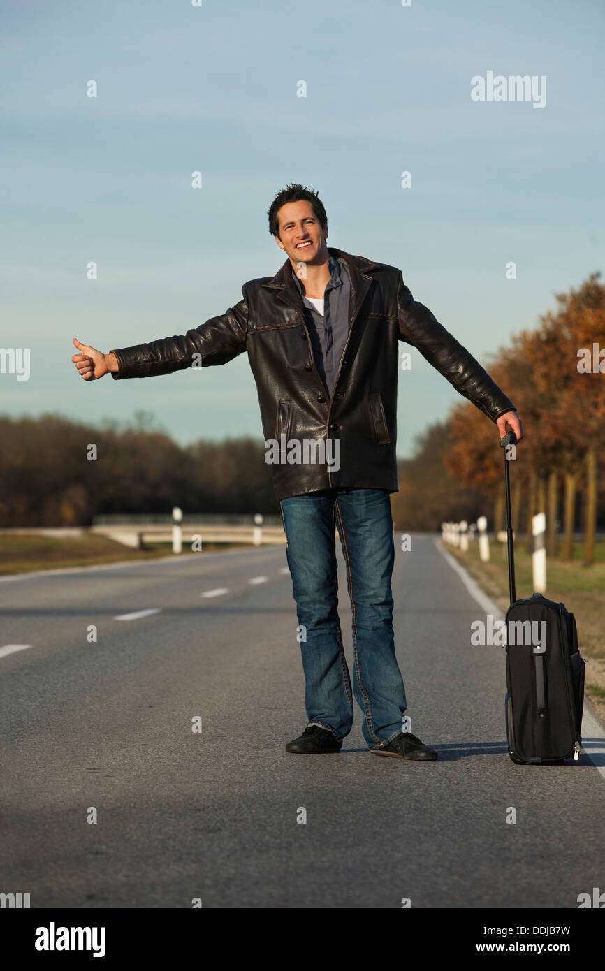 Hitchhiker man bag hi-res stock photography and images - Alamy