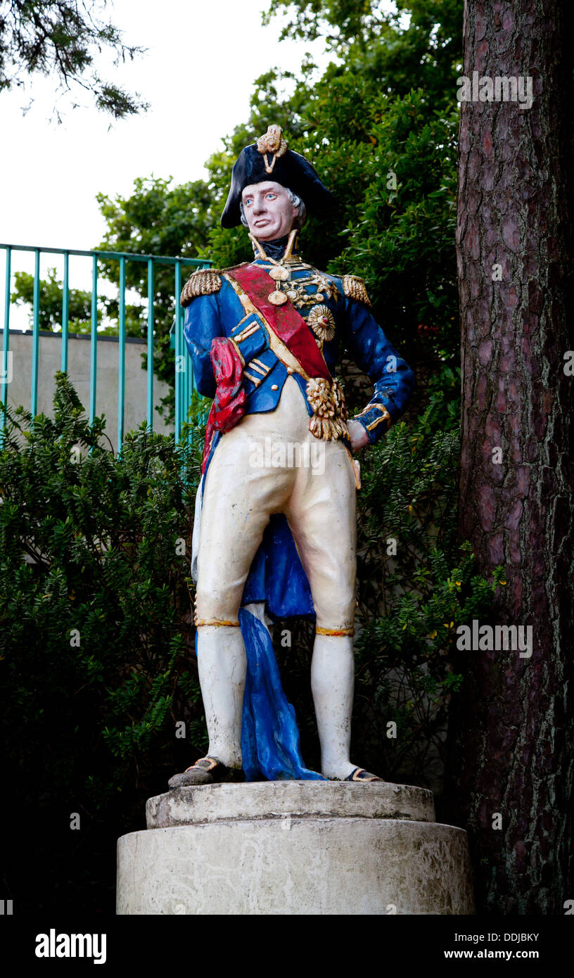 Painted statue of Admiral Lord Nelson on the quayside of Portmeirion ...