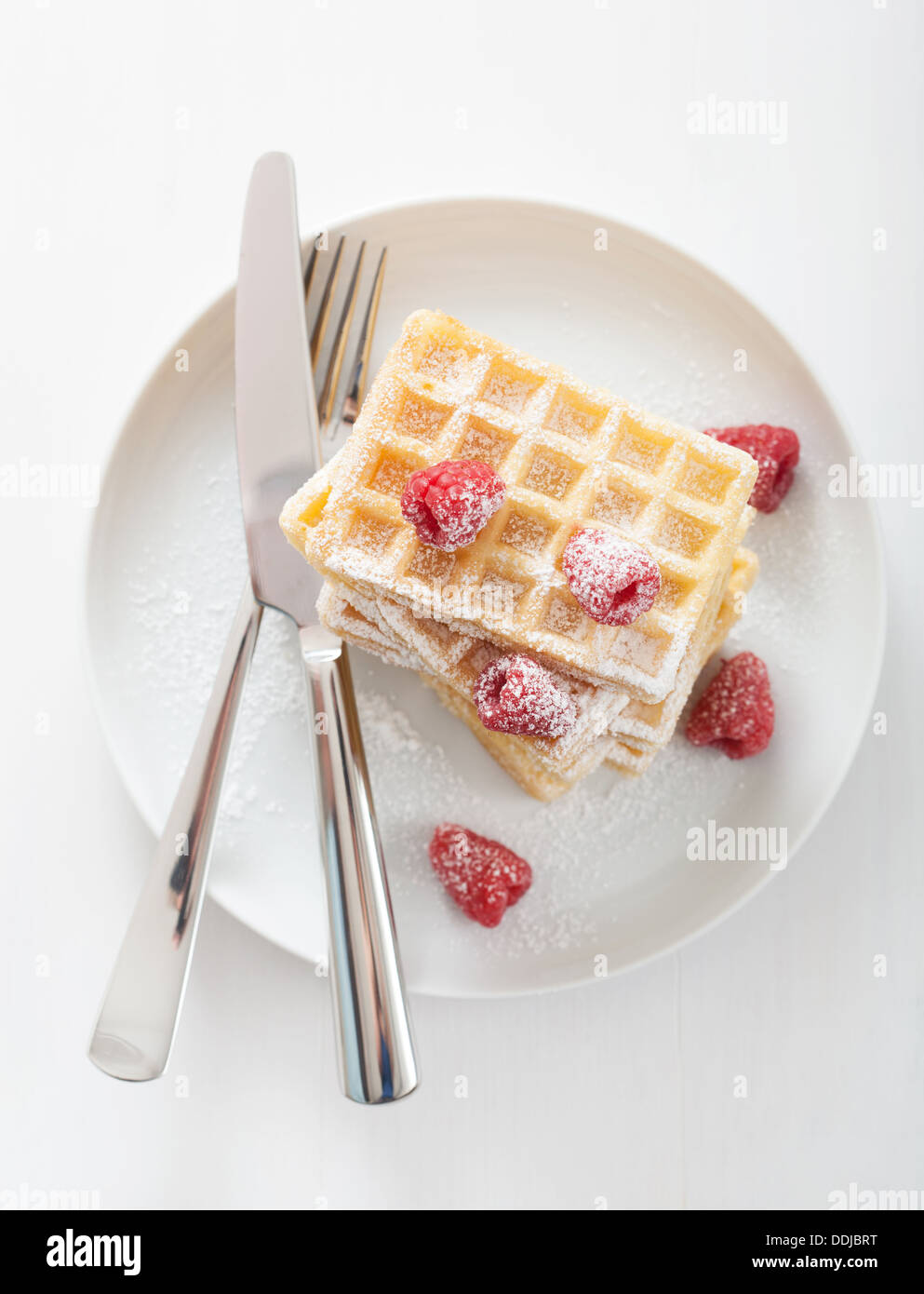 waffle with raspberry and icing sugar Stock Photo - Alamy