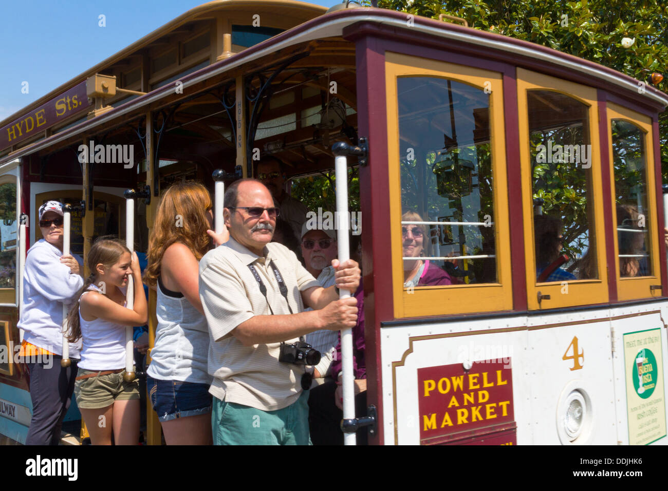 Tourists enjoying a cable car ride in San Francisco Stock Photo - Alamy