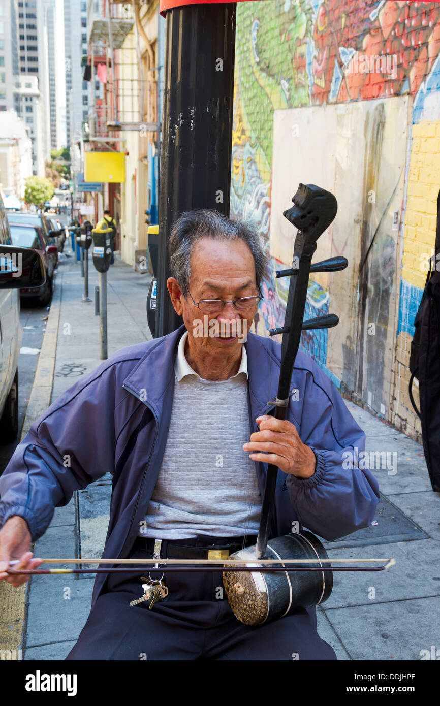 Traditional Chinese musician playing on a street corner in Chinatown in ...