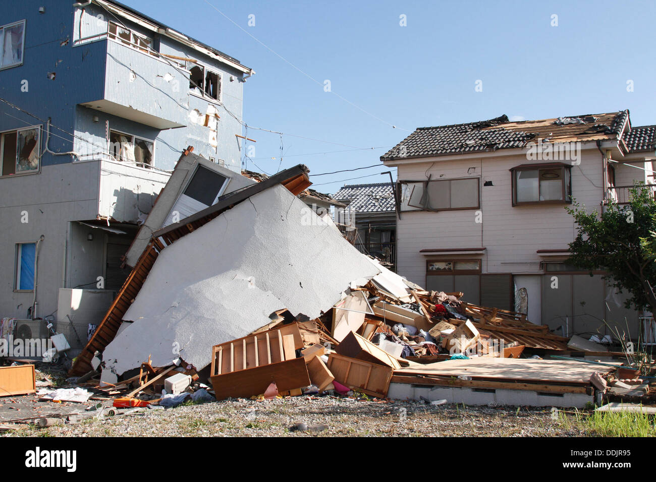 Koshigaya, Japan. 3rd Sep, 2013. Damaged buildings and debris are seen ...