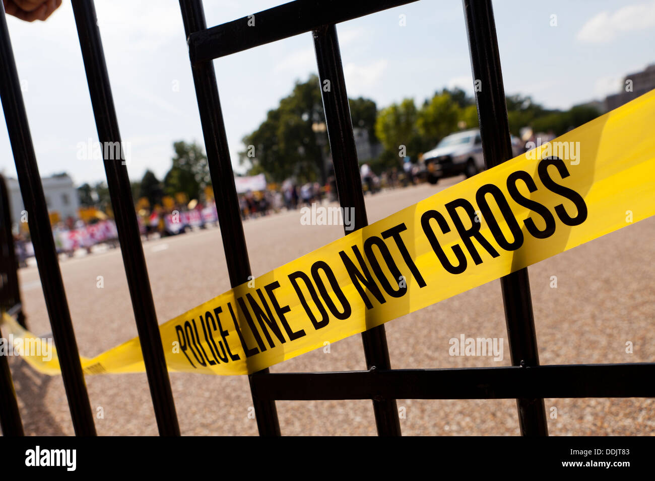 "Police Line Do Not Cross" tape against barricade fence - Washington ...