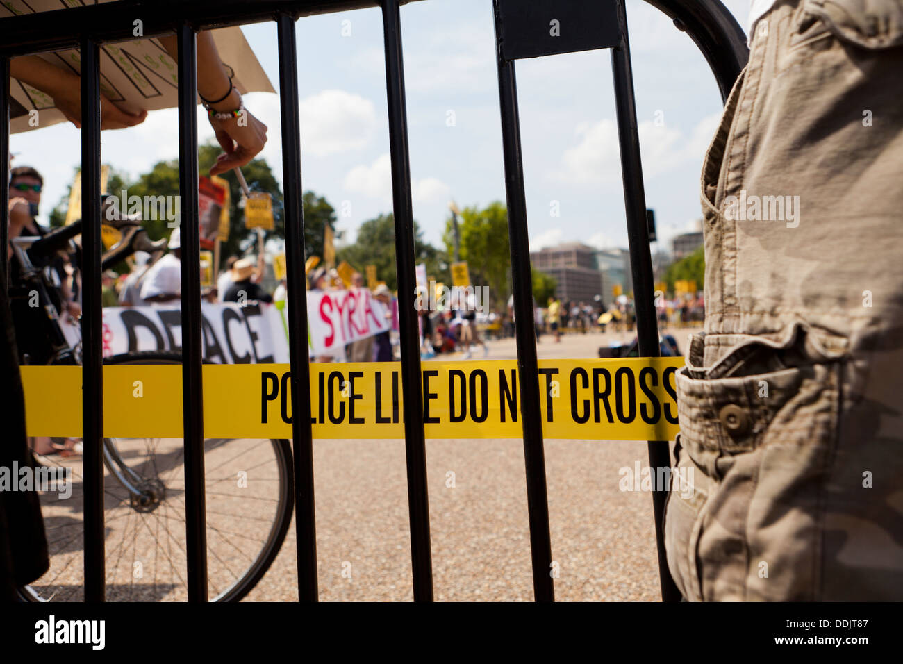 "Police Line Do Not Cross" tape against barricade fence - Washington ...