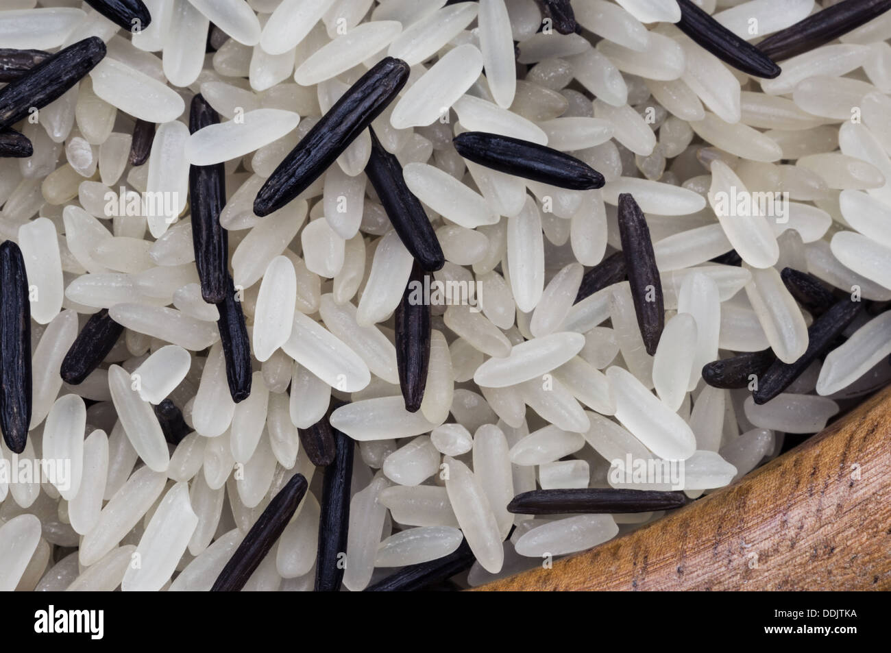 wild rice and the white rice in a wooden bowl Stock Photo - Alamy