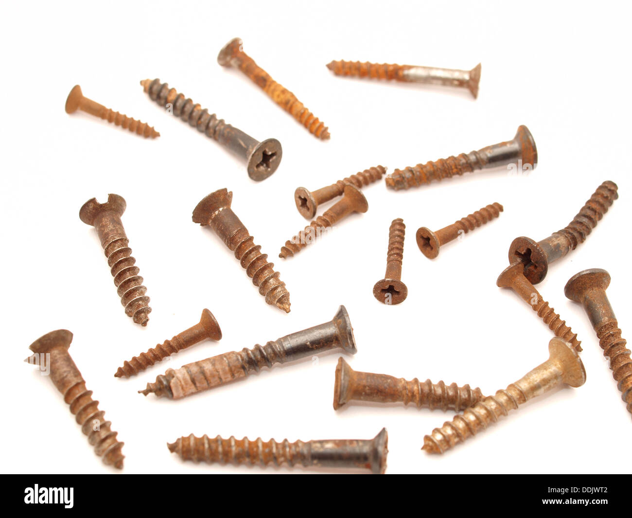 Rusty bolts and screws on a white background Stock Photo - Alamy