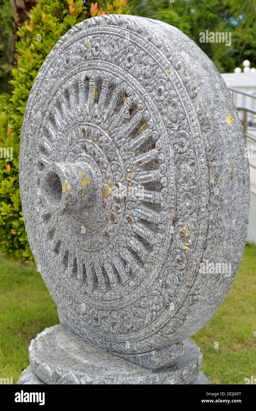 Dharma Wheel - Dharmacakra - at Wat in Thailand - with gold leaf stuck ...