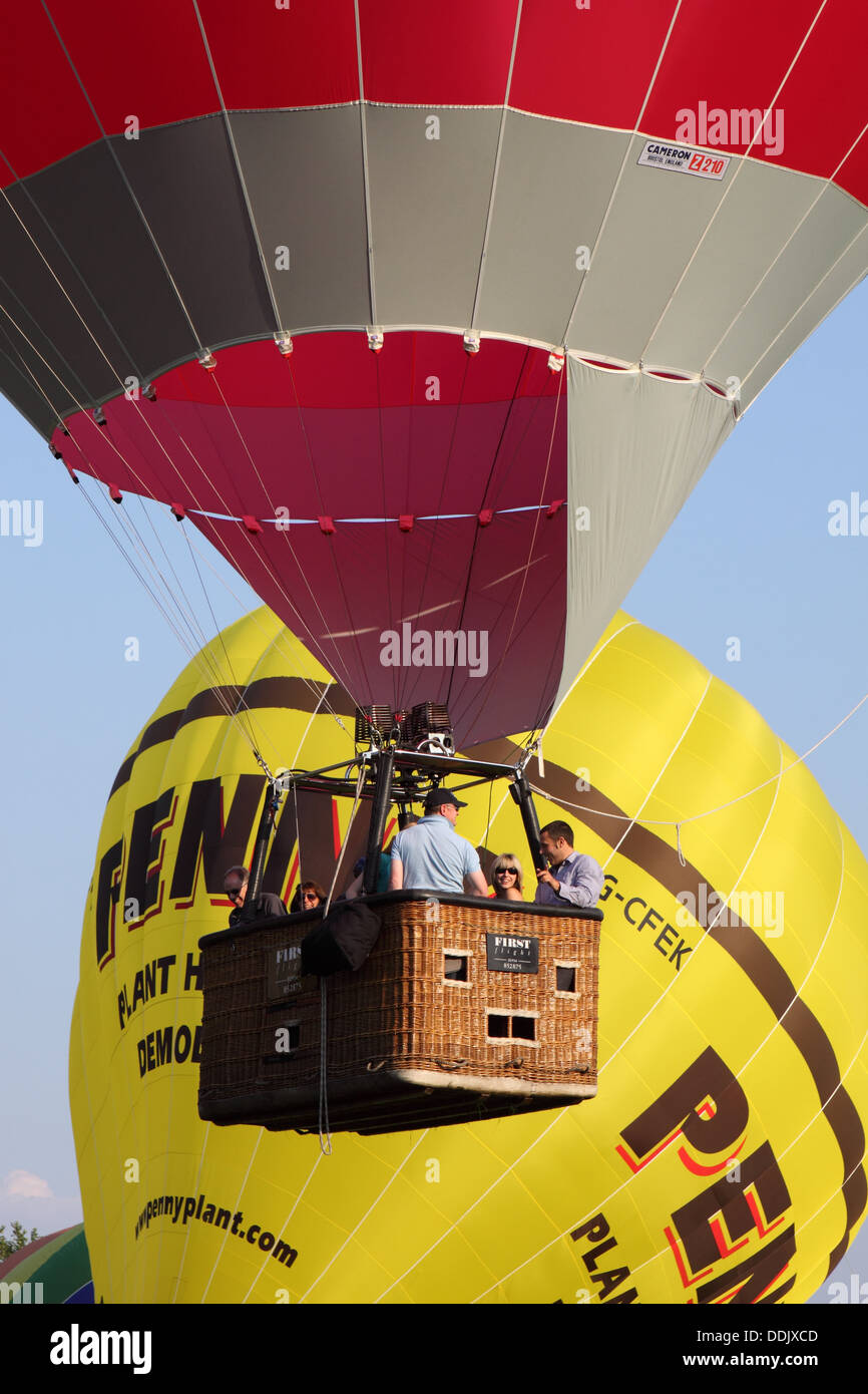Hot Air balloon flight passengers in basket taking off Stock Photo - Alamy