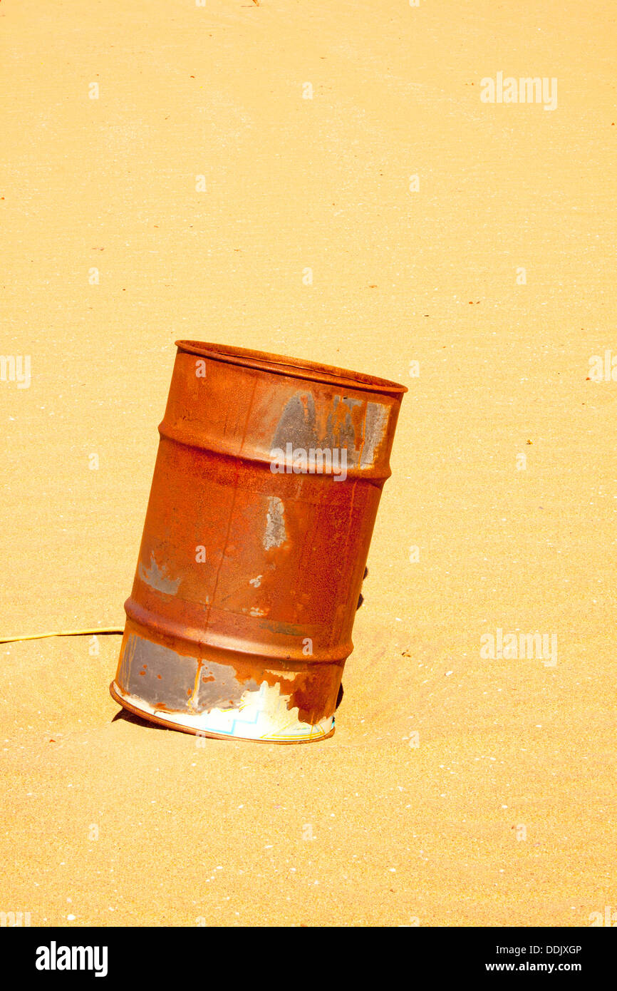 Rusted oil barrel on beach Stock Photo - Alamy