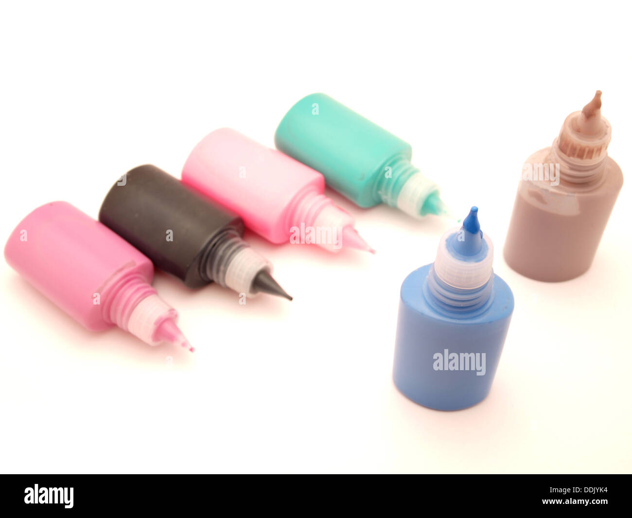 Color tubes with a paint on a white background Stock Photo - Alamy