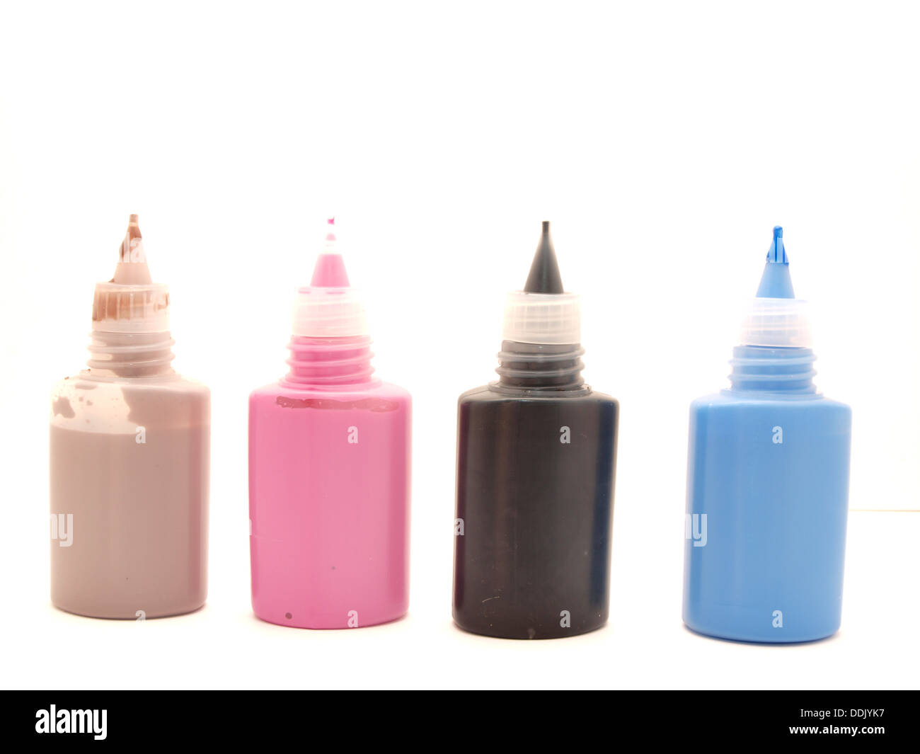 Color tubes with a paint on a white background Stock Photo - Alamy