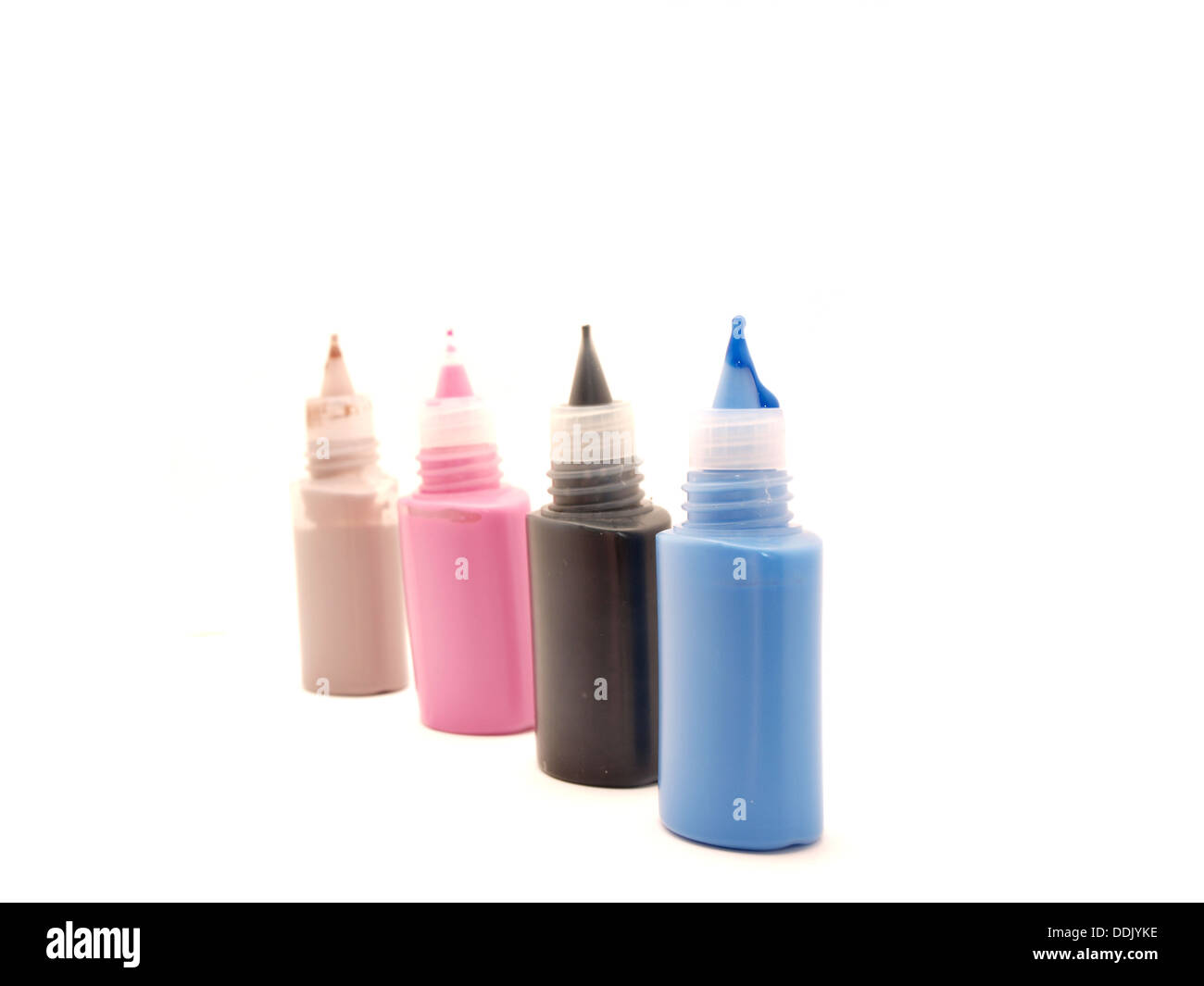 Color tubes with a paint on a white background Stock Photo - Alamy