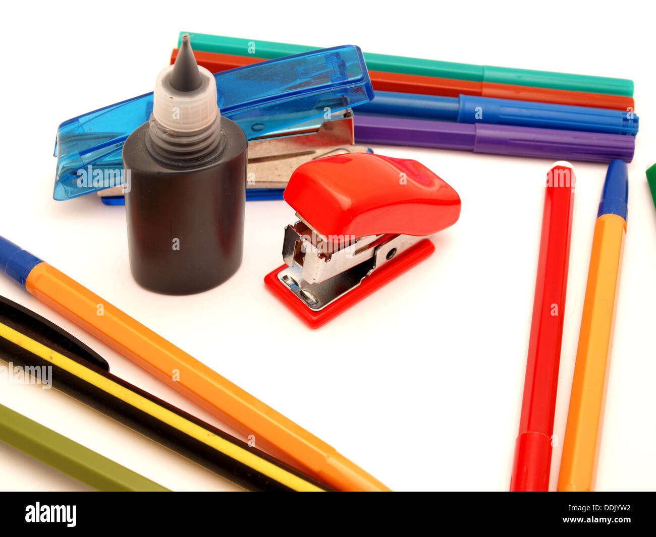 Felt-tip pens, stapler and paint on a white background Stock Photo - Alamy