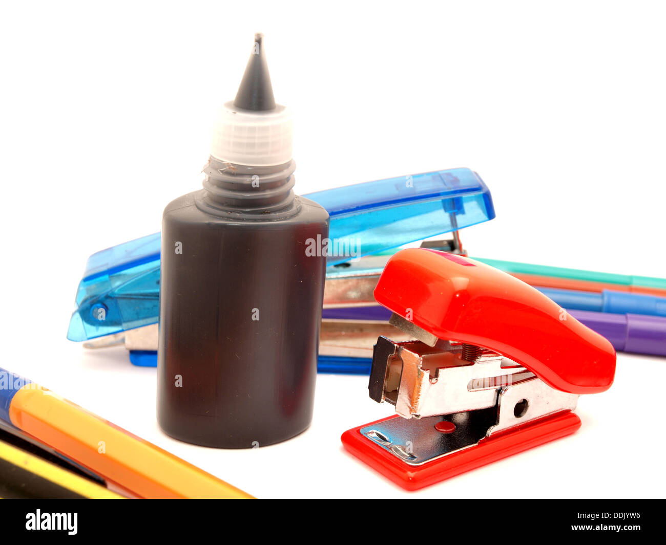Felt-tip pens, stapler and paint on a white background Stock Photo - Alamy
