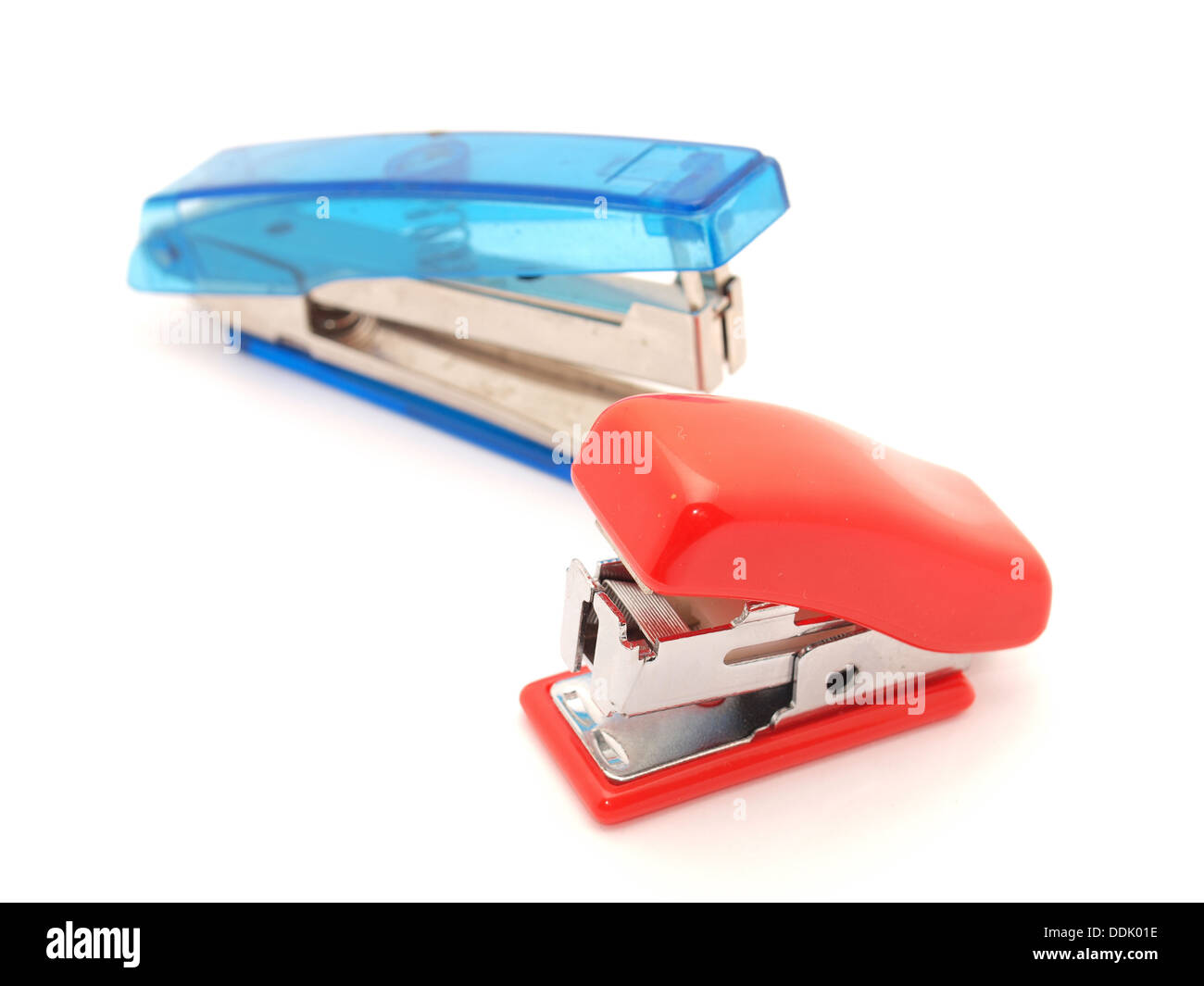 Two staplers on a white background Stock Photo - Alamy