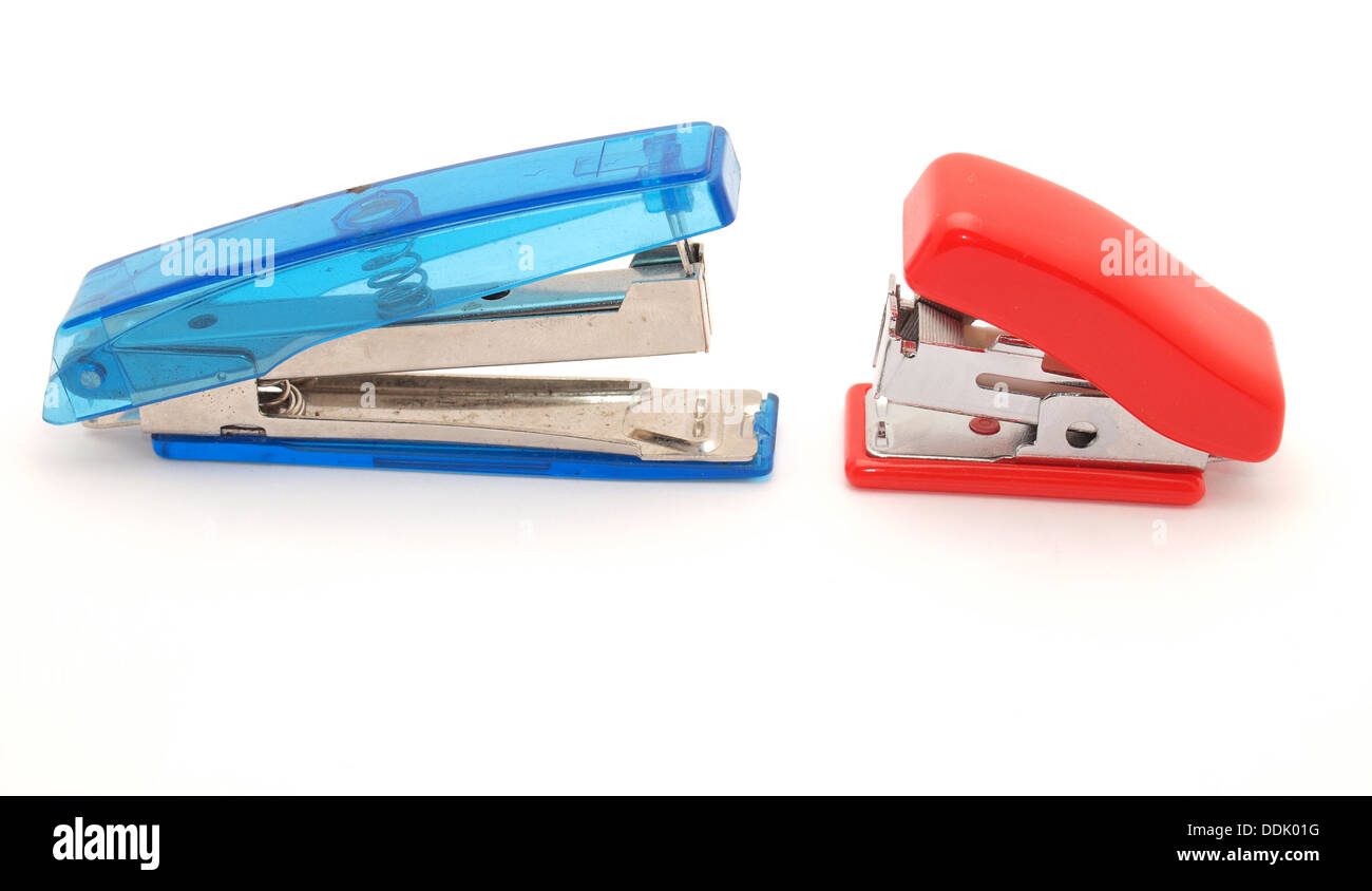 Two staplers on a white background Stock Photo - Alamy