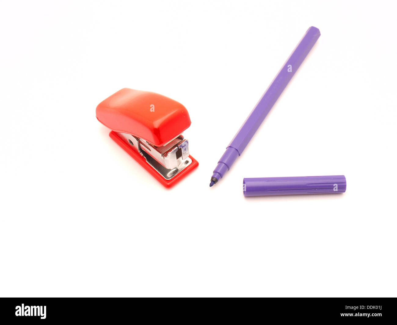 Stapler and a felt-tip pen on a white background Stock Photo - Alamy